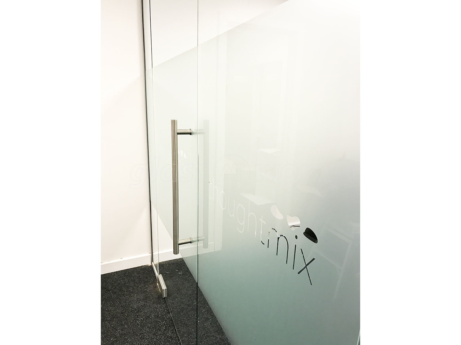 Glass Partitioning at Thoughtmix (Lincoln): Glass Partition with Glass Door Glass Partitioning at Thoughtmix (Lincoln): Glass Partition with Glass Door
